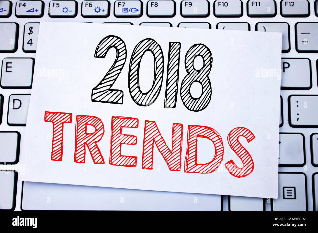 Handwritten text caption showing 2018 Trends. Business concept writing ...