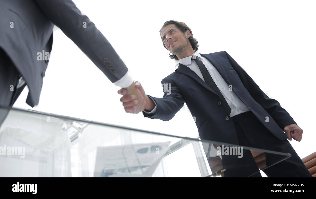 Two young professionals shaking hands hi-res stock photography and ...