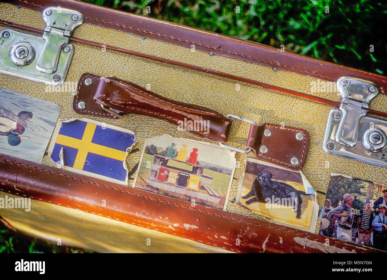Suitcase with labels Stock Photo - Alamy