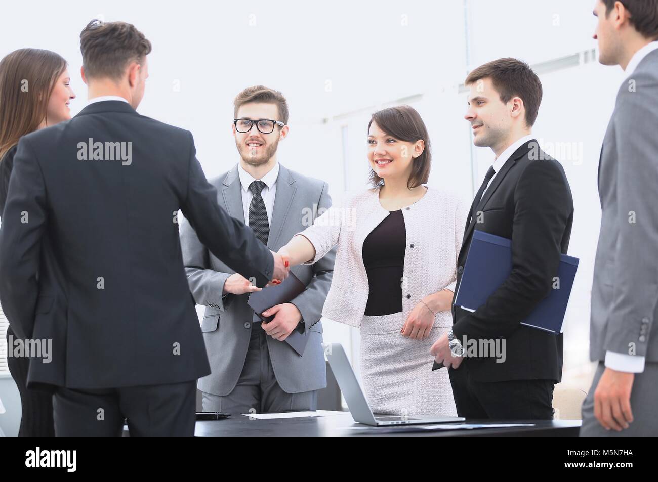 handshake of business partners standing next to their lawyers Stock Photo - Alamy