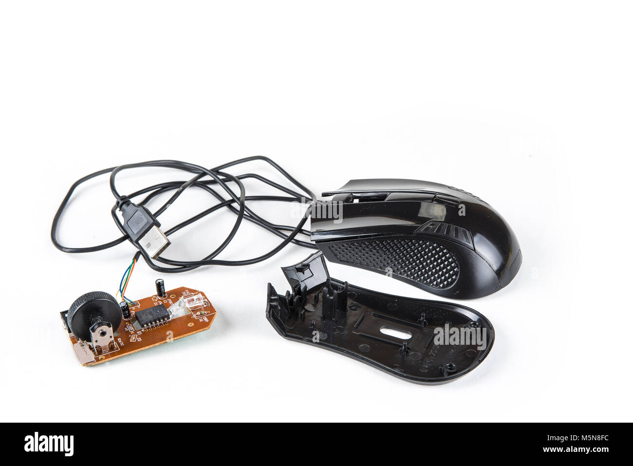 Dismantled computer mouse with USB cable on the white Stock Photo - Alamy