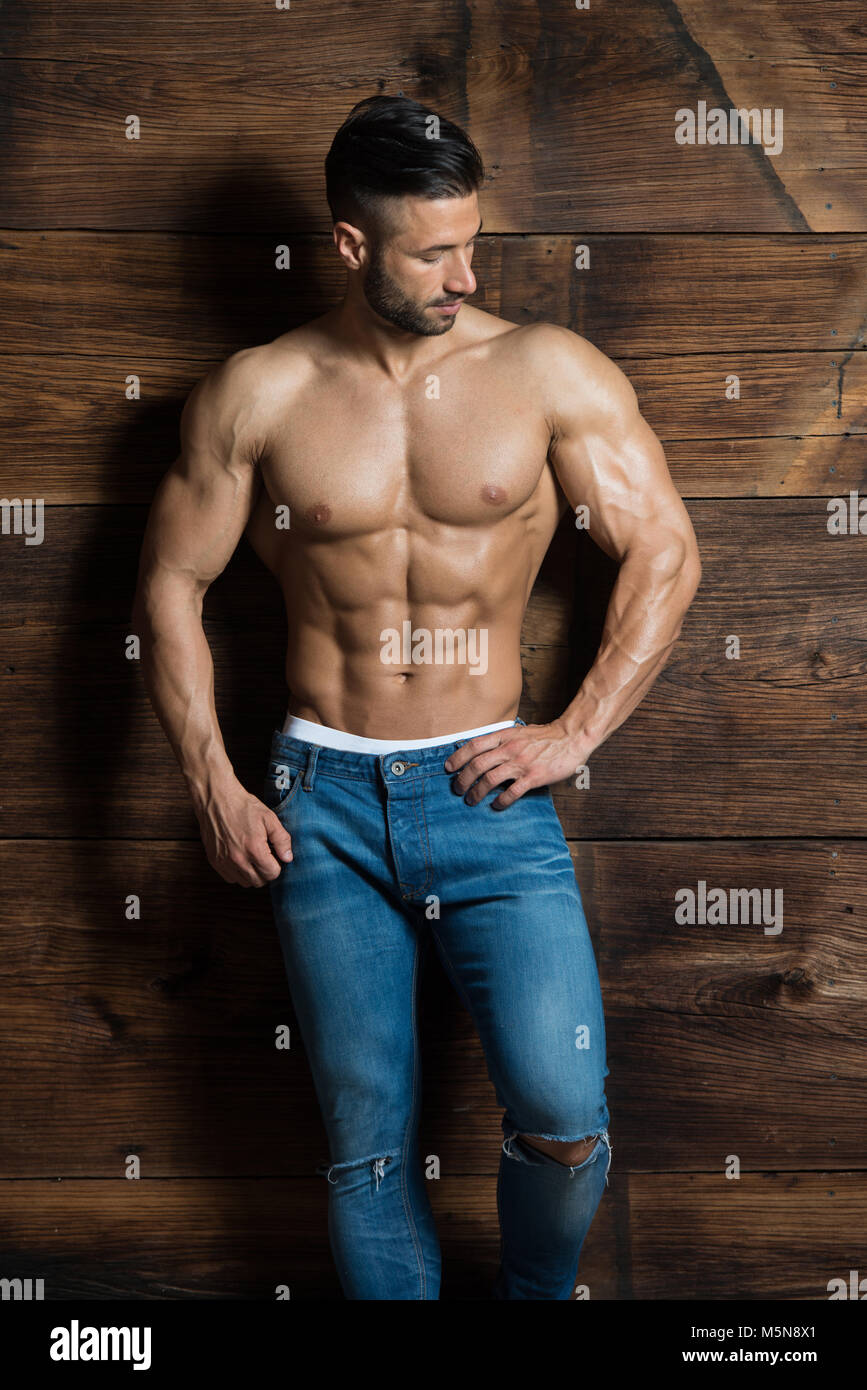 Portrait of a Young Physically Fit Man Showing His Well Trained Body ...