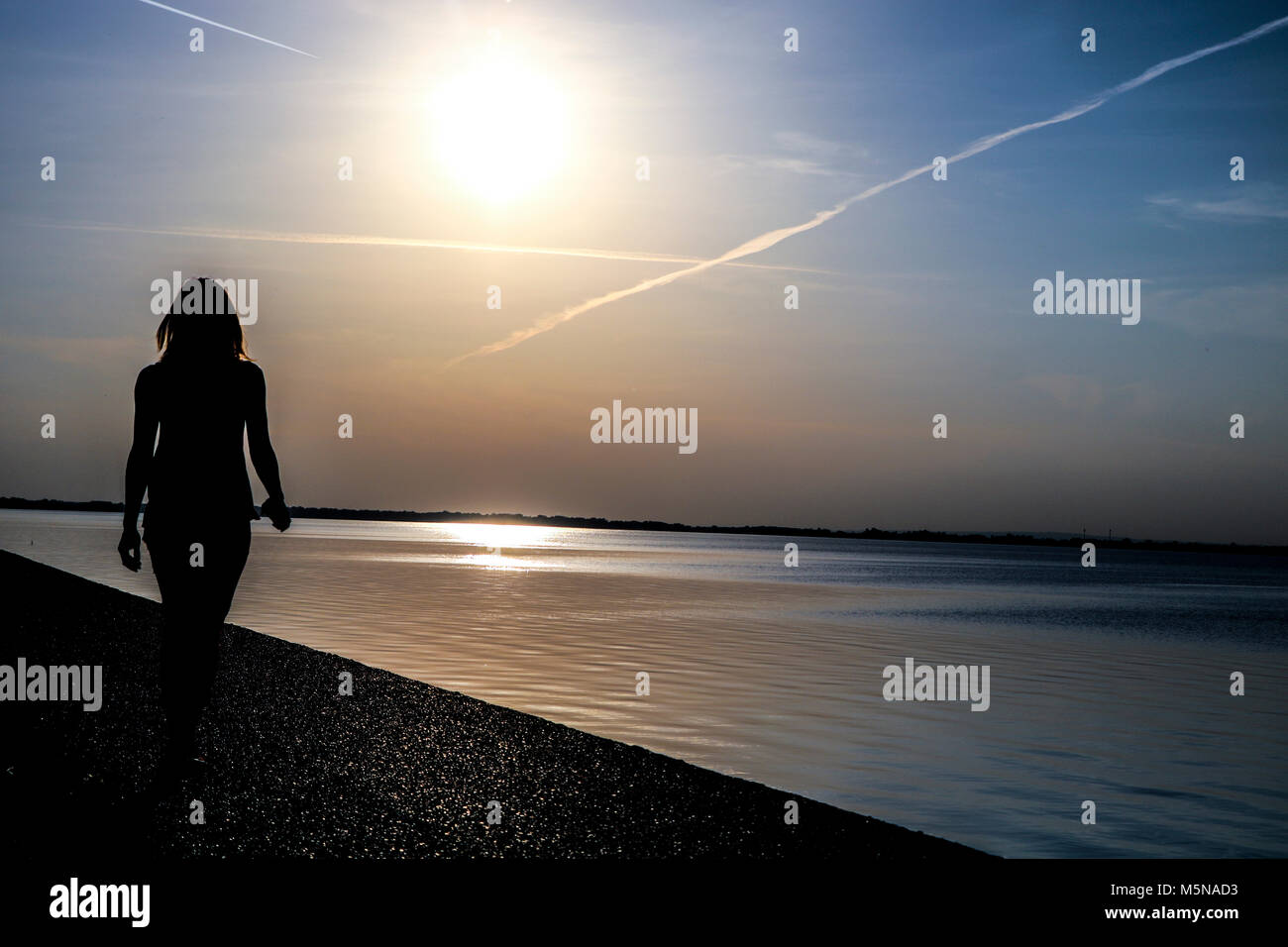 Woman in sunset hi-res stock photography and images - Alamy