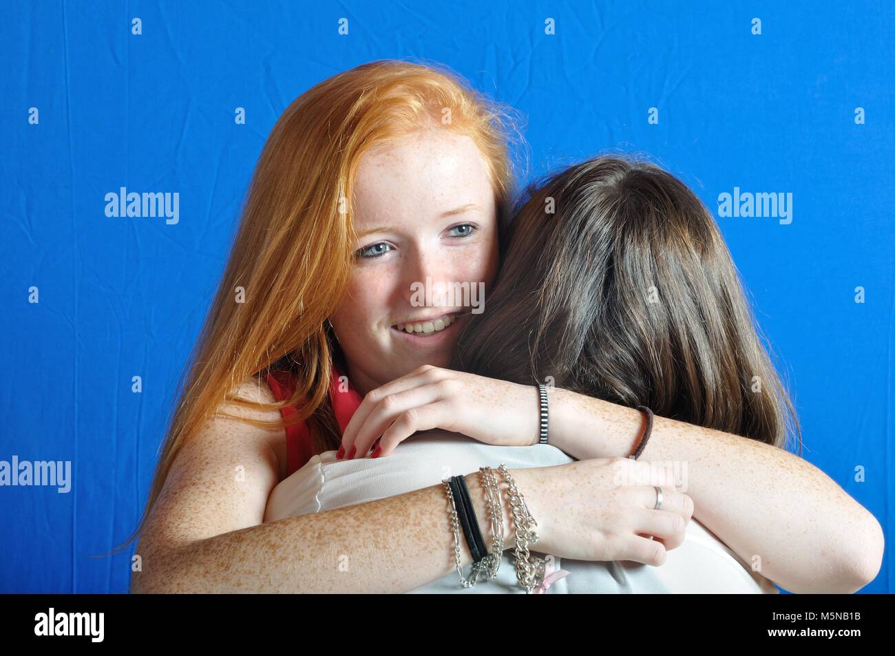 Kid friends hugging each other hi-res stock photography and images - Alamy