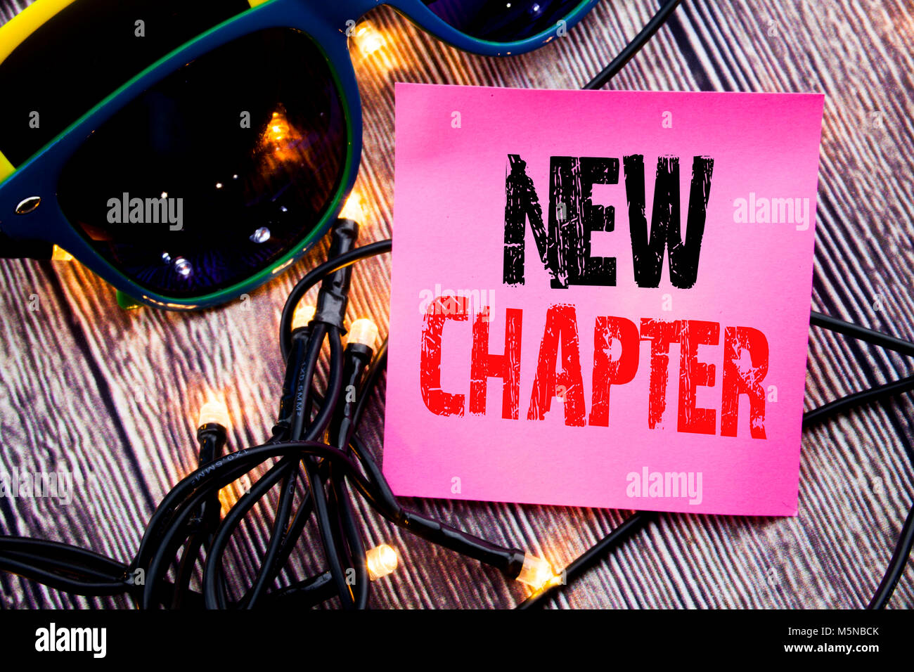 Hand writing text caption showing New Chapter. Business concept for ...