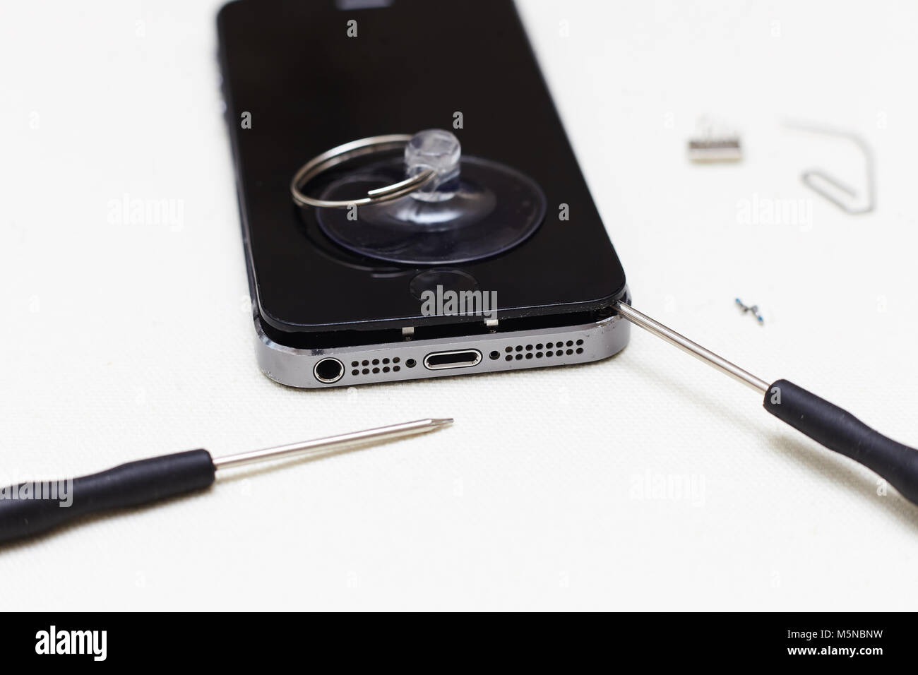 Close-up photos showing process of mobile phone repair, changing the ...
