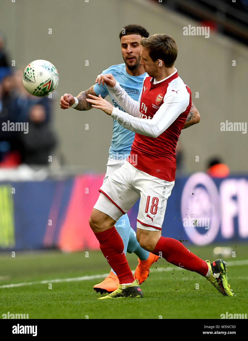 Manchester City's Kyle Walker (back) and Arsenal's Nacho Monreal battle ...