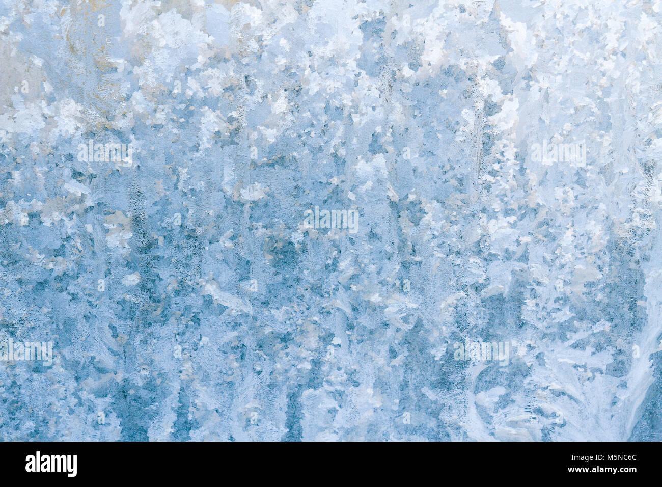 Winter frosty patterns on the frozen ice window Stock Photo - Alamy