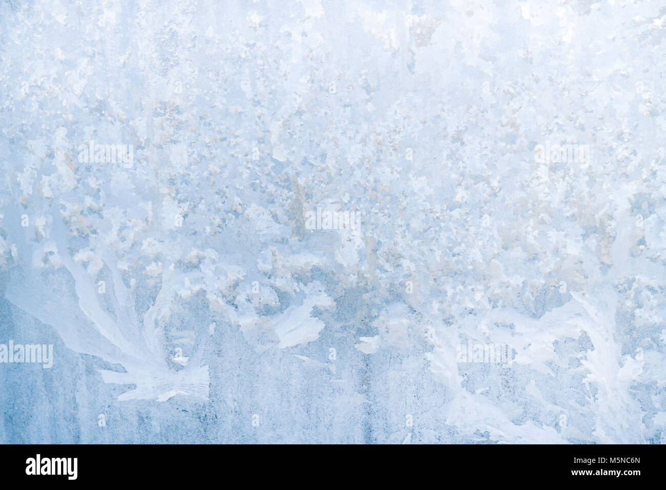 Winter frosty patterns on the frozen ice window Stock Photo - Alamy