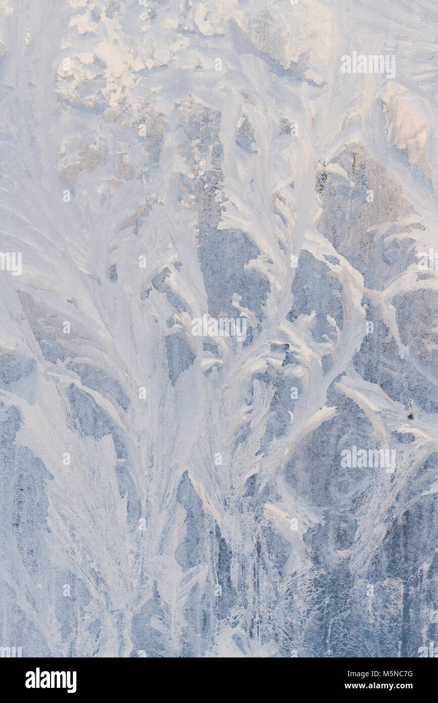 Winter frosty patterns on the frozen ice window Stock Photo - Alamy