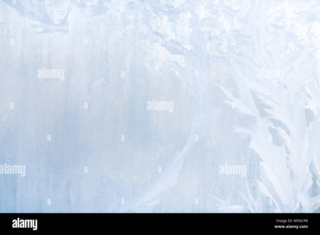 Winter frosty patterns on the frozen ice window Stock Photo - Alamy