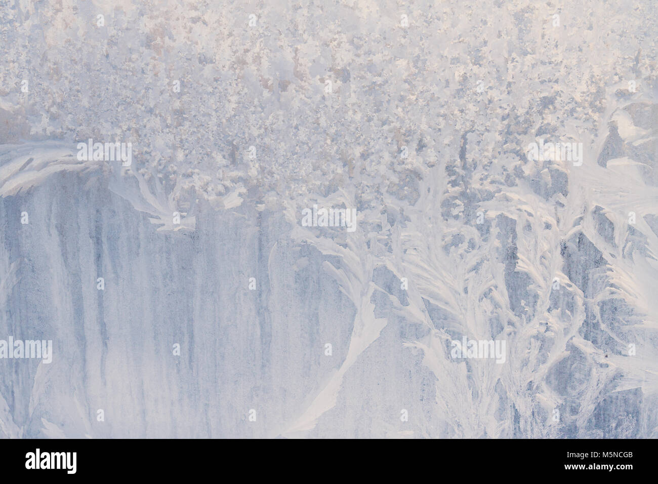 Winter frosty patterns on the frozen ice window Stock Photo - Alamy