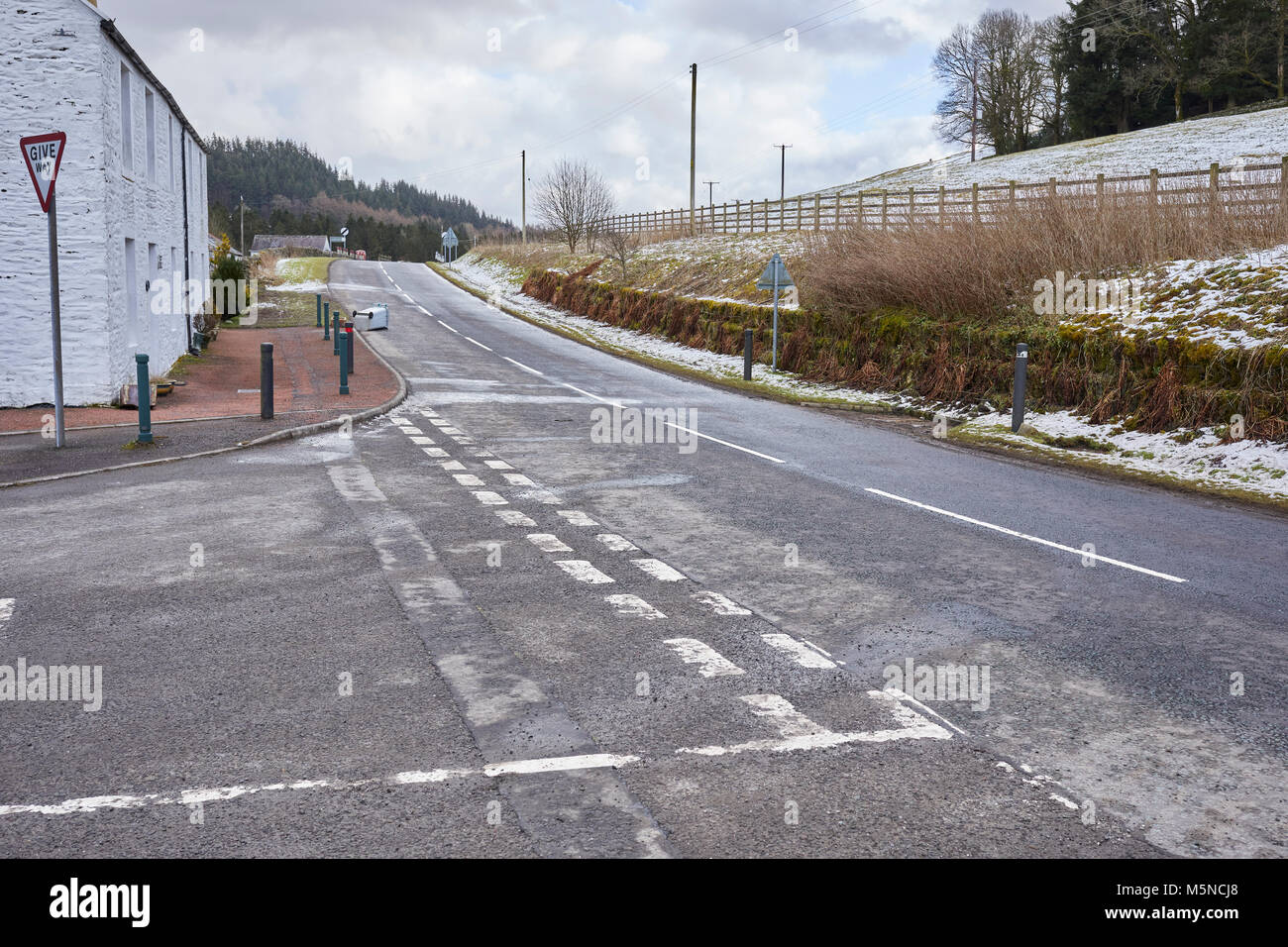 Looking south east at the junction to Bentpath on the B709. Windblown ...