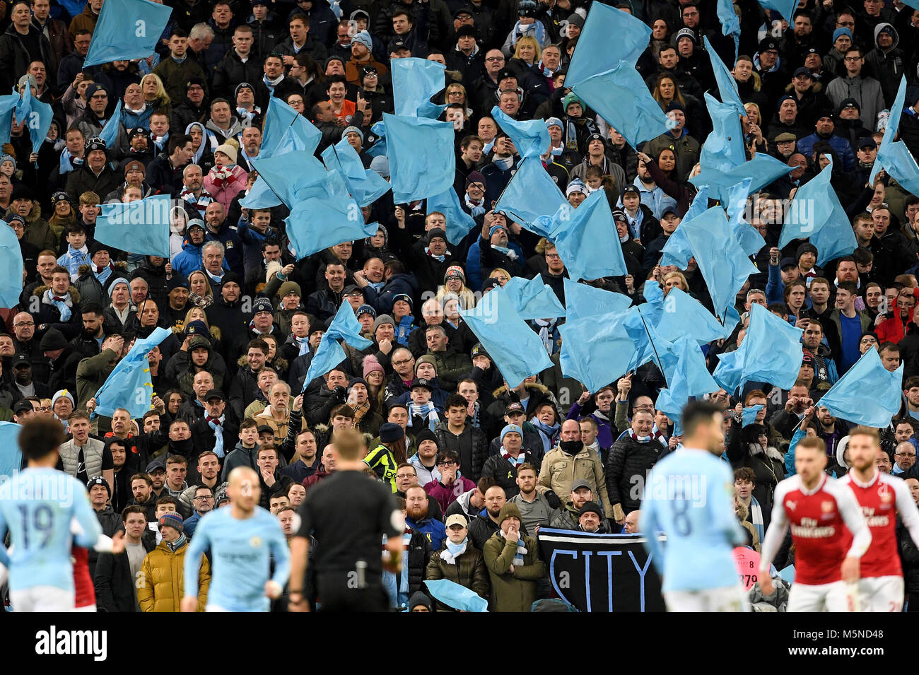Manchester city fans waving flags hi-res stock photography and images ...