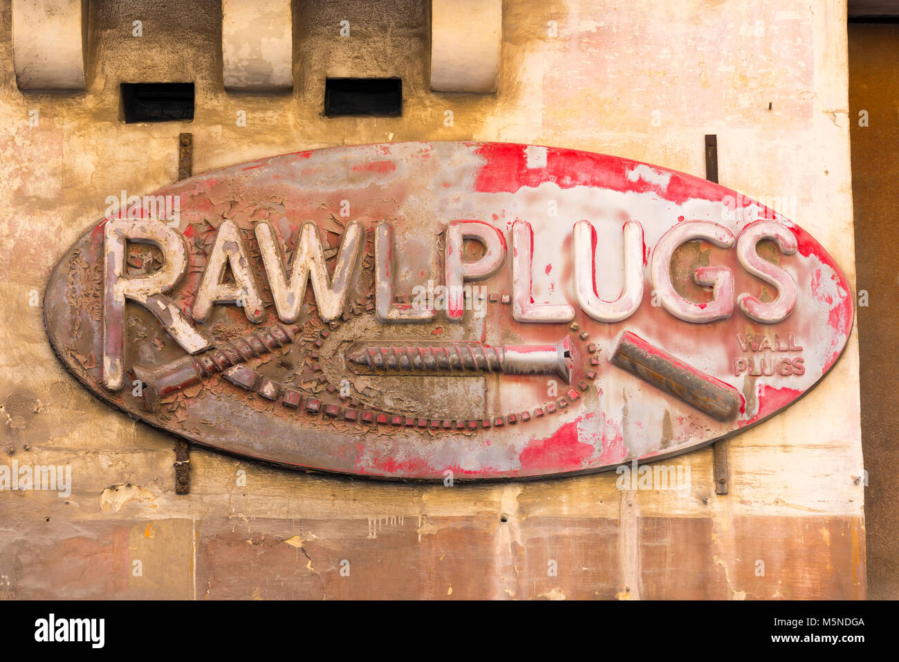 Vintage Old Rusty Rawl Plugs Sign very deteriorated Stock Photo - Alamy