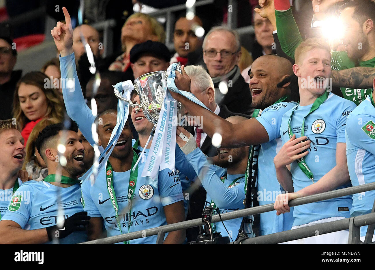 Manchester City's Vincent Kompany (centre) celebrates with the trophy ...