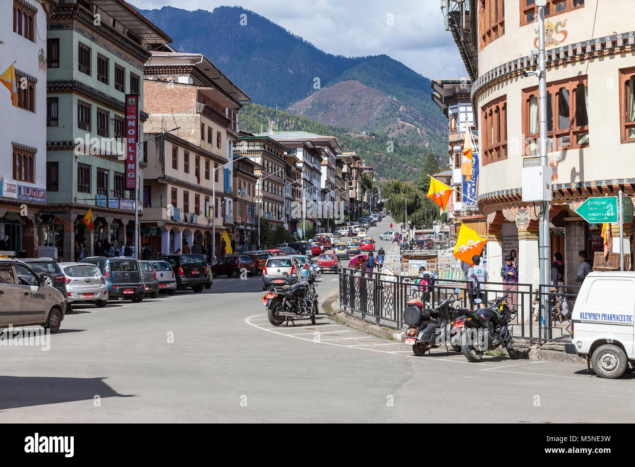 Thimphu, Bhutan. Street Scene, Central Thimphu. National Flags on Right ...