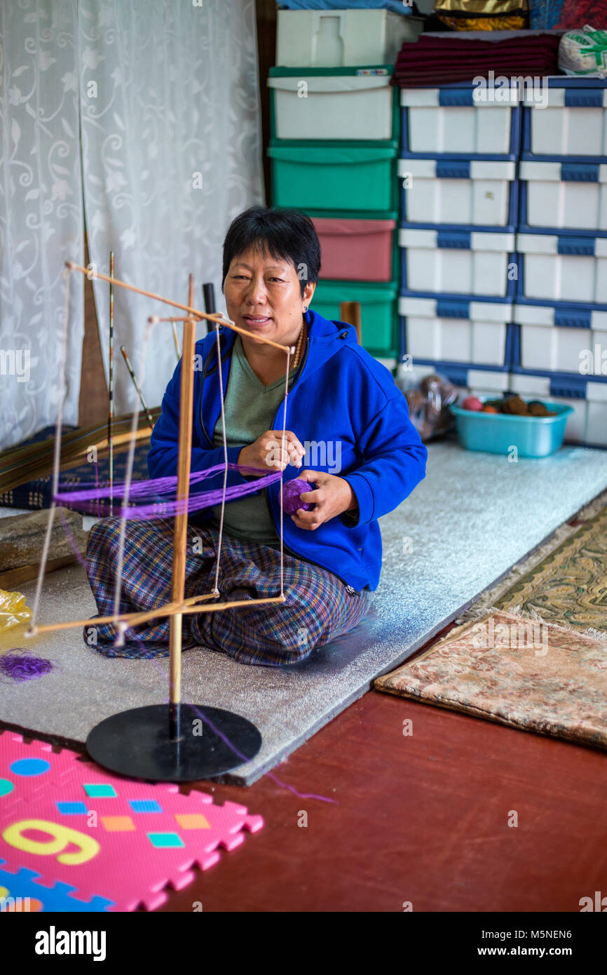 Thimphu, Bhutan. Woman Spinning Thread in her Workshop Stock Photo - Alamy