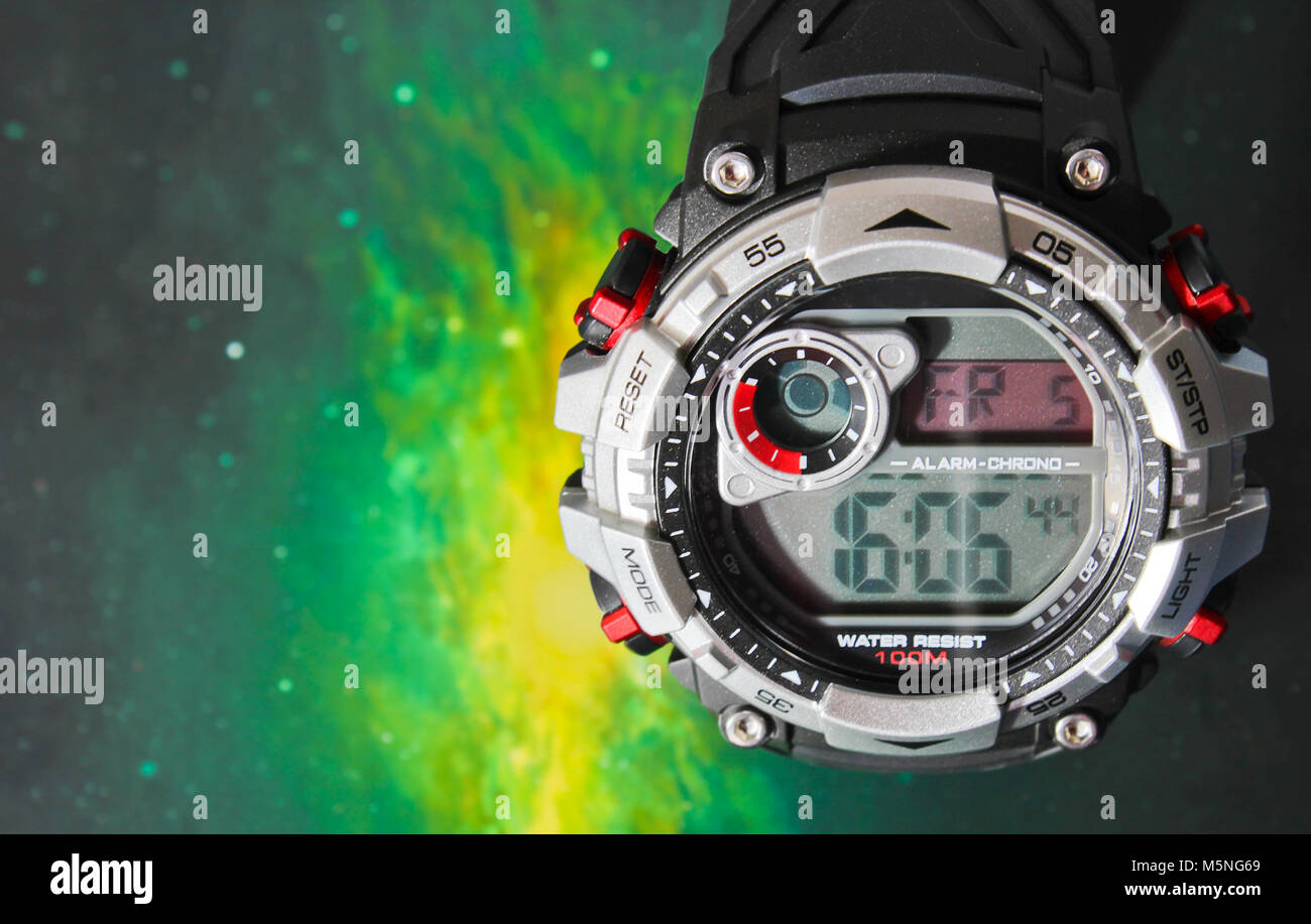 Men digital sport hand watch on green and yellow background Stock Photo ...