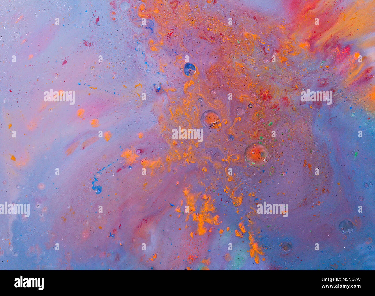 Abstract orange and violet color mix in milk and oil Stock Photo - Alamy