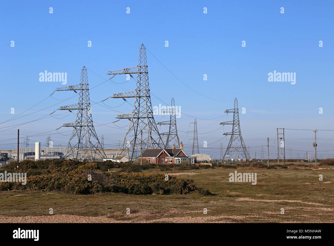 Pylons carrying power from the Nuclear Power Station, Dungeness, Kent ...