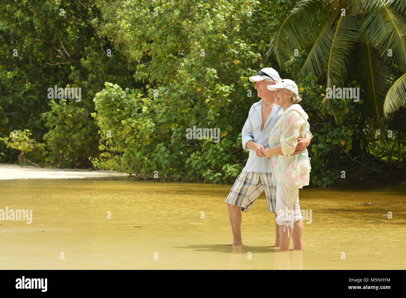 Mature couple hugging beach family hi-res stock photography and images ...