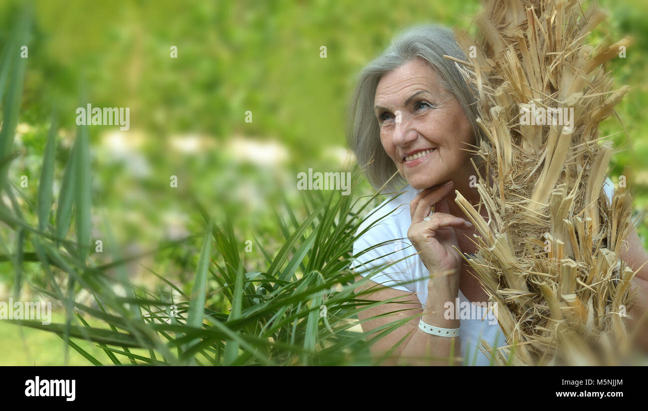Mature woman palm tree hi-res stock photography and images - Alamy