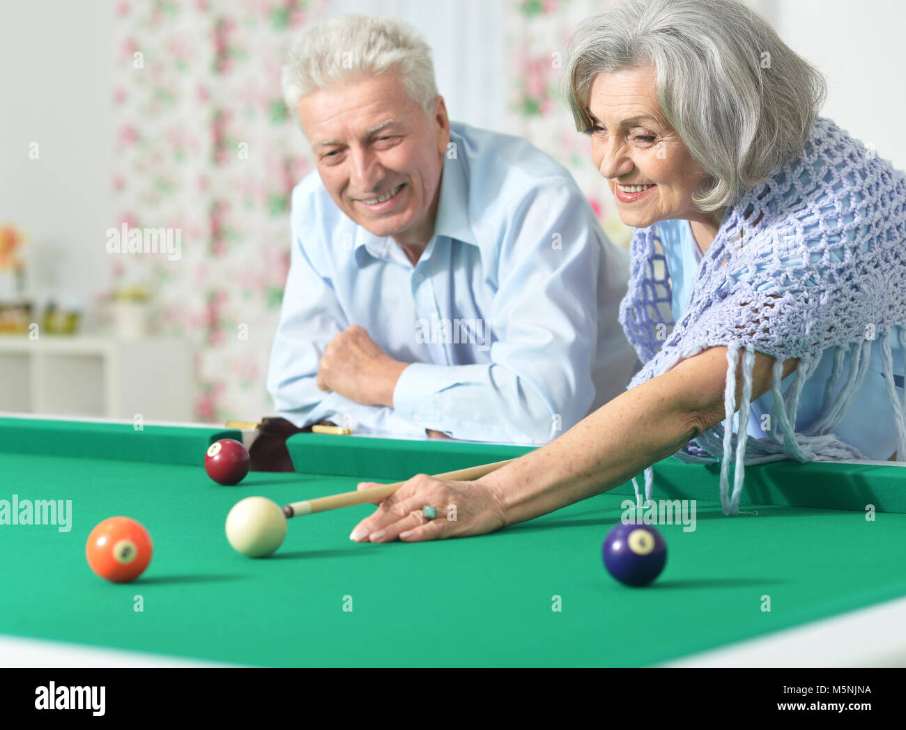 senior couple playing billiard Stock Photo - Alamy