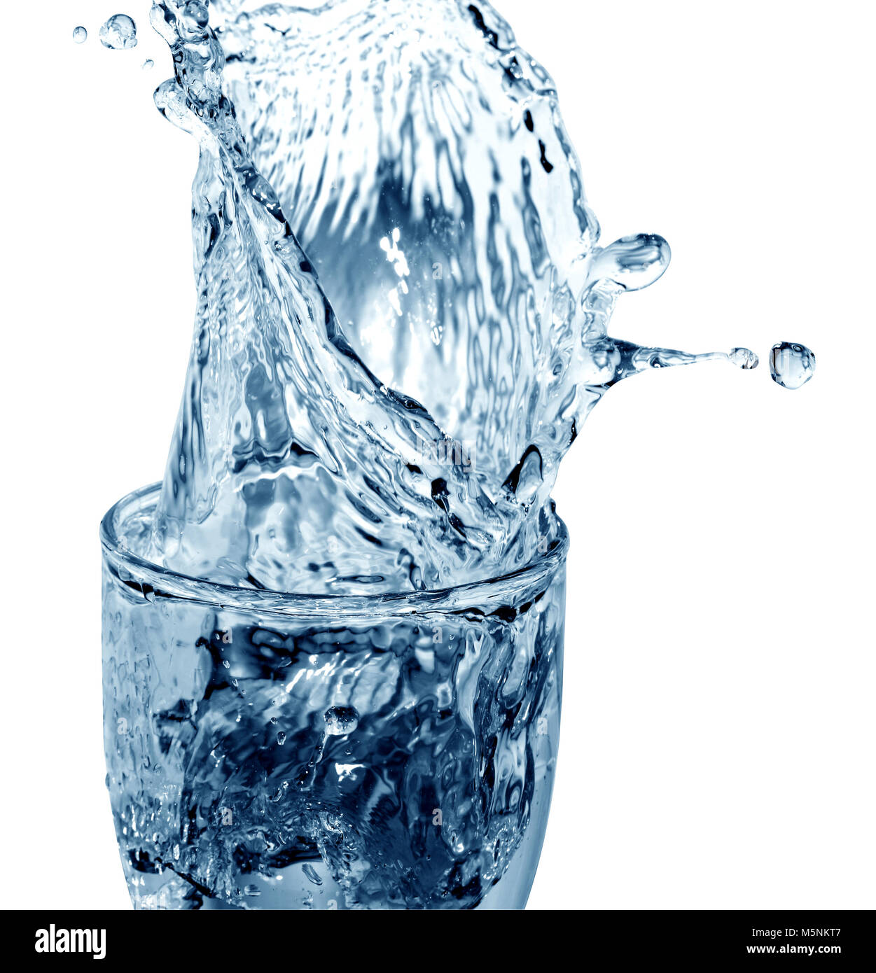 Glass of splashing water isolated on white background with clipping ...