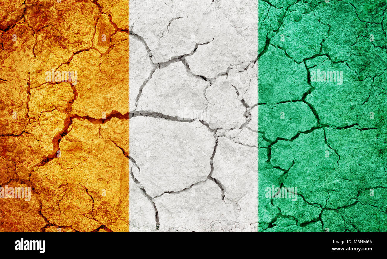 Republic of Ivory Coast flag on dry earth ground texture background ...