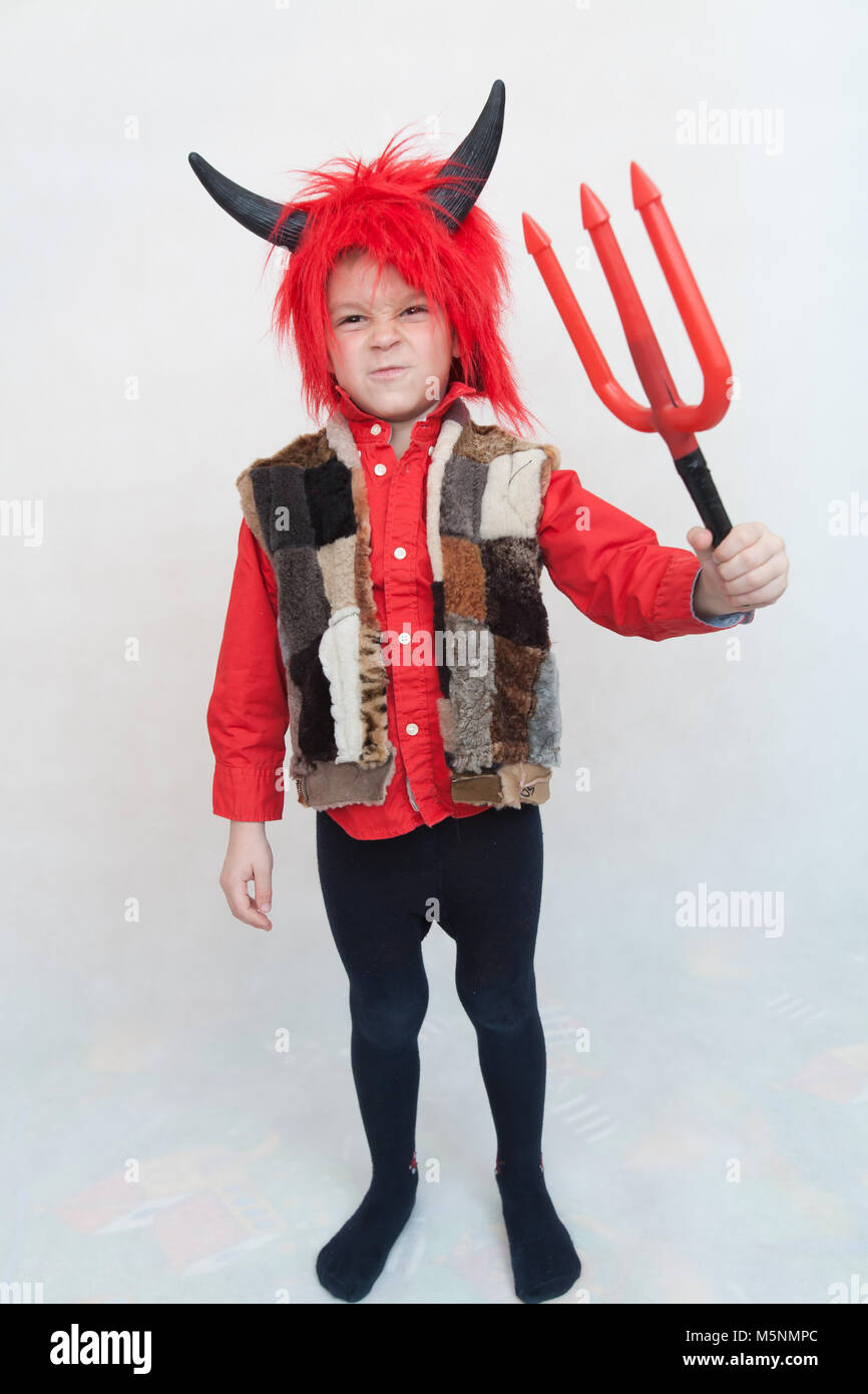 Child boy devil horns trident hi-res stock photography and images - Alamy