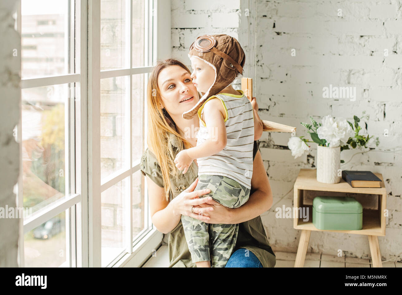 Smiling Mummy and Little Boy Son Hugging at Home Stock Photo - Alamy