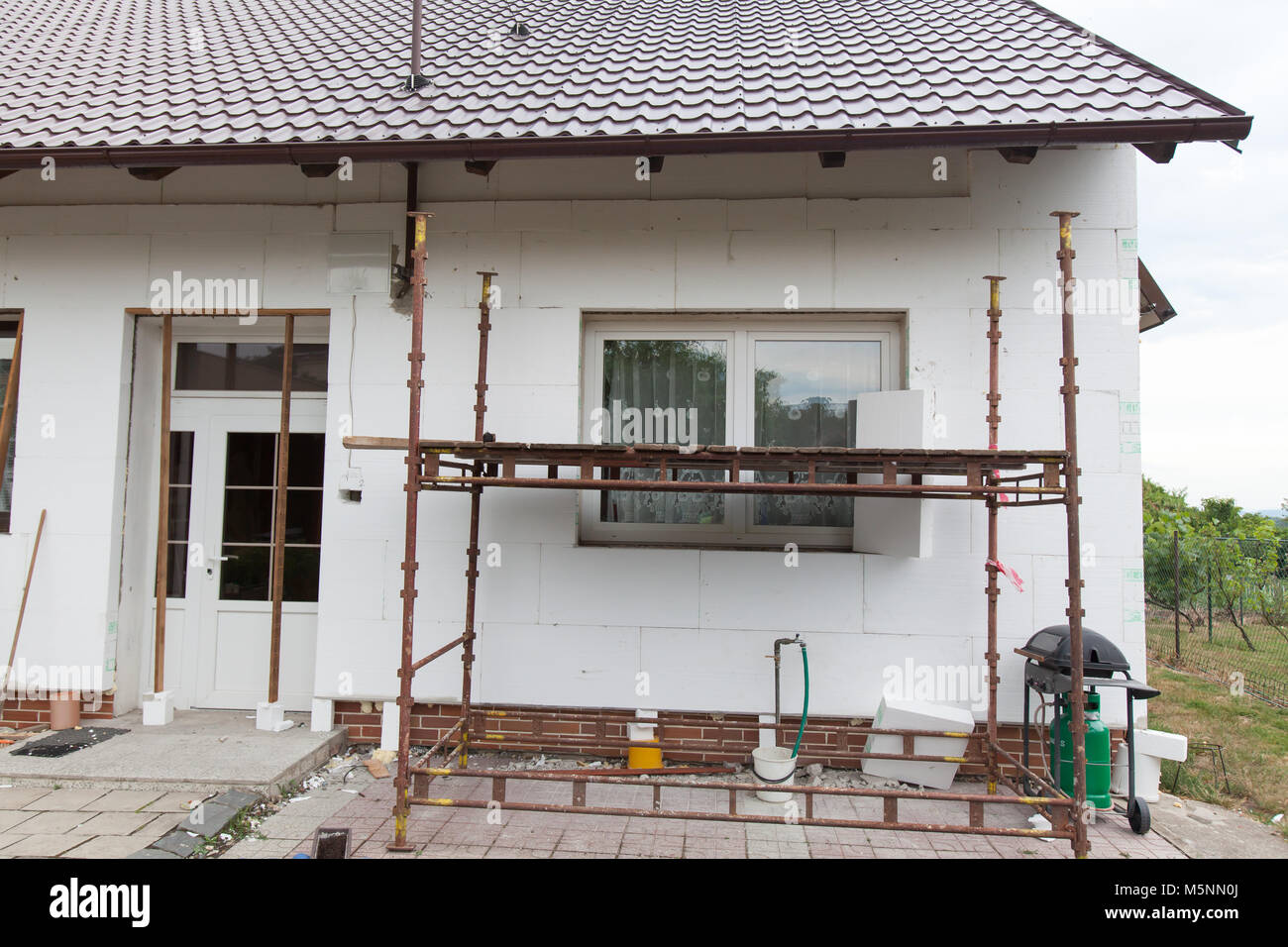 Reconstruction of the old house (insulation facade polystyrene Stock ...