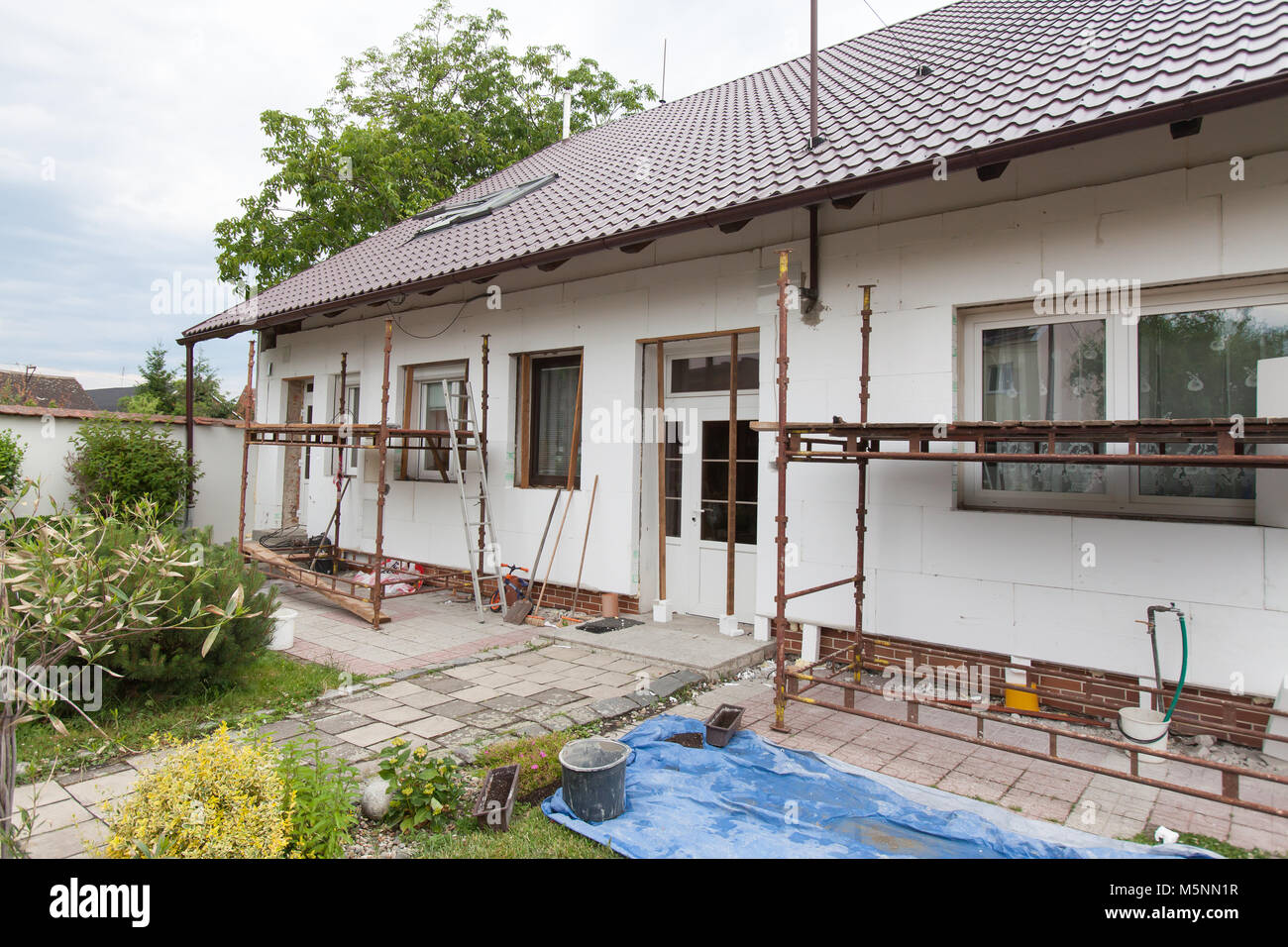 Reconstruction of the old house (insulation facade polystyrene Stock ...