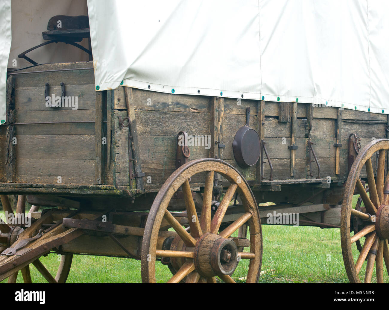 Covered vintage pioneer wagon wild west style Stock Photo - Alamy