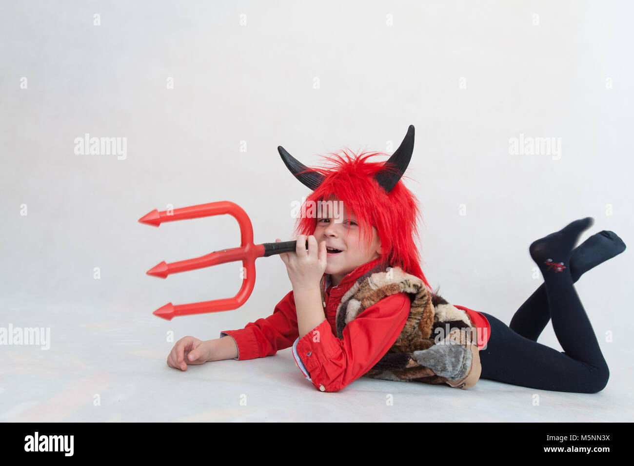 Child boy devil horns trident hi-res stock photography and images - Alamy