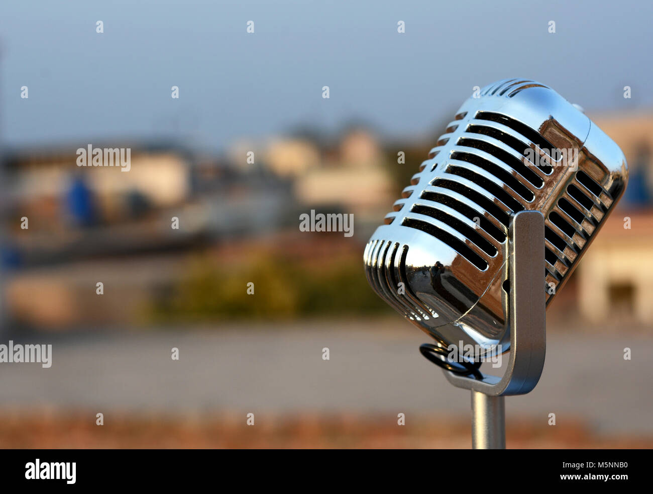 Vintage metal microphone closeup view outdoor Stock Photo - Alamy
