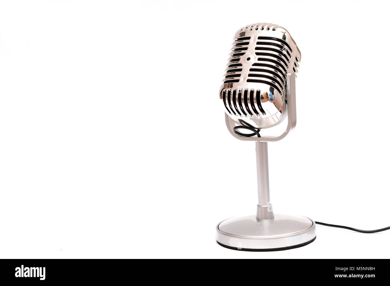 Vintage style microphone isolated on white background Stock Photo - Alamy