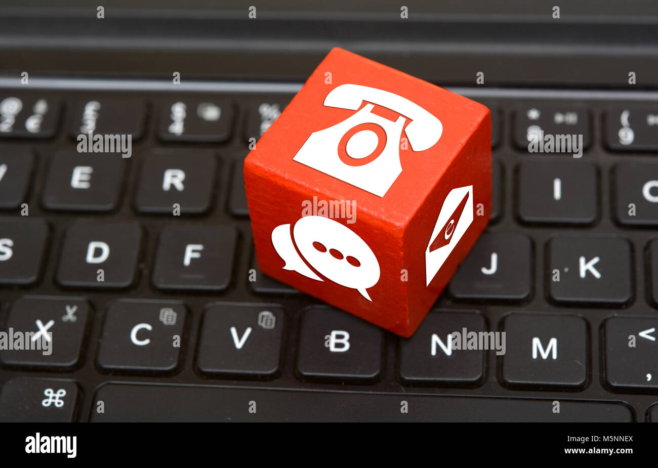 Contact Us icons on Red Dice on top of keyboard Customer service Stock ...