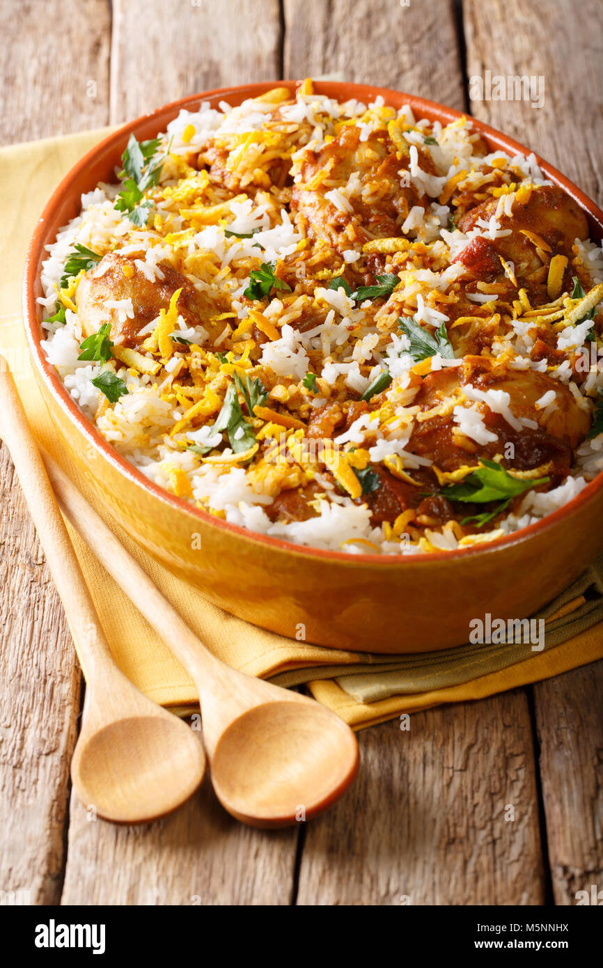 Delicious homemade biryani with chicken, onion, lemon, spices and ...