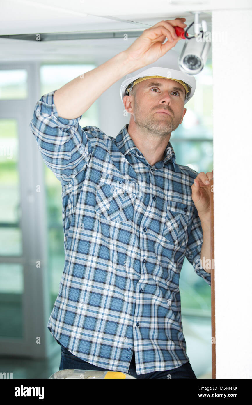 Engineer man working on cctv system hi-res stock photography and images ...