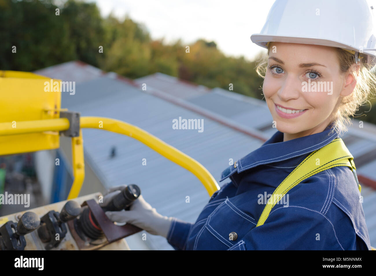 Woman in cherry picker bucket Stock Photo - Alamy