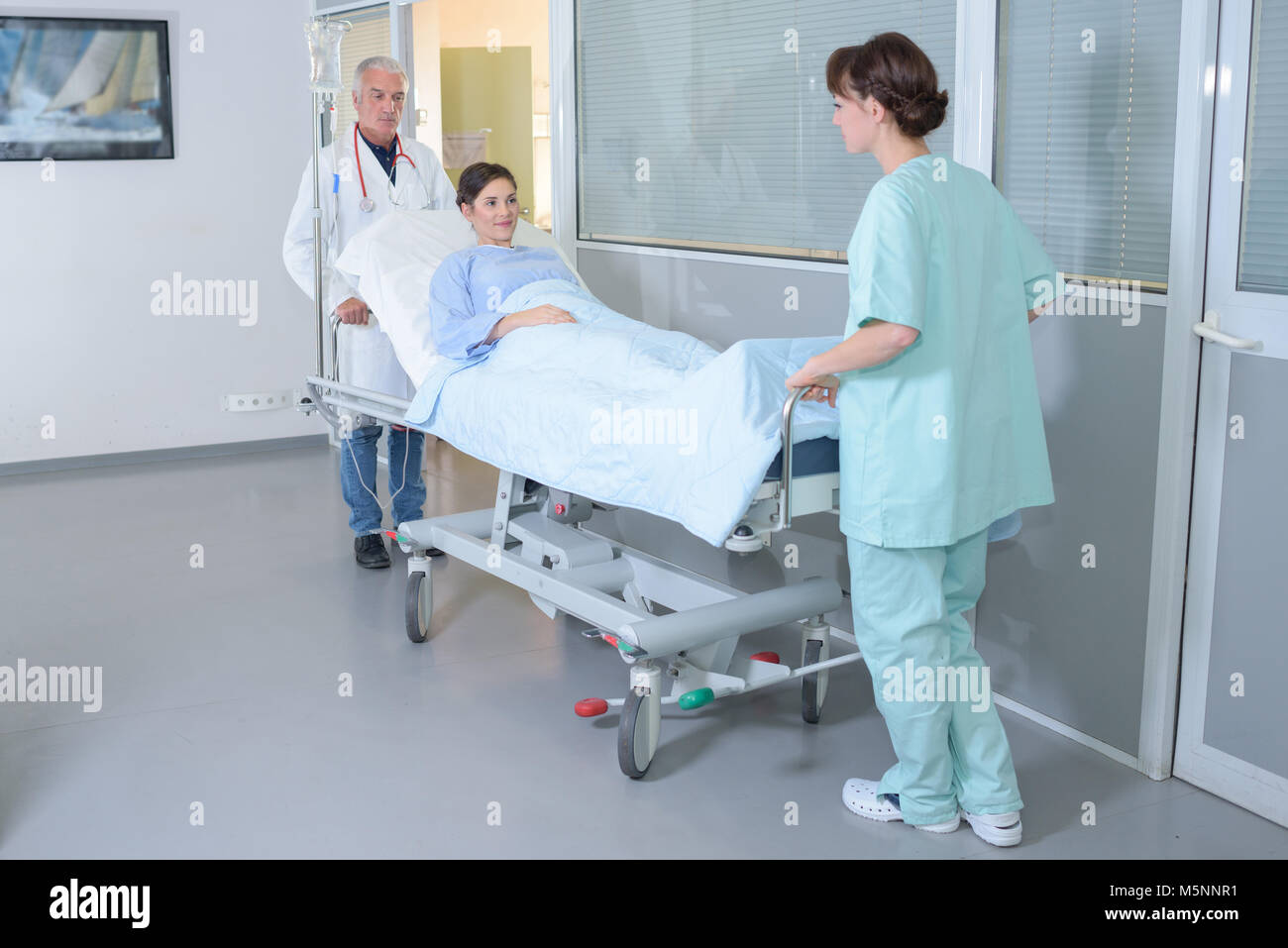 Hospital corridor patient and trolley hi-res stock photography and ...