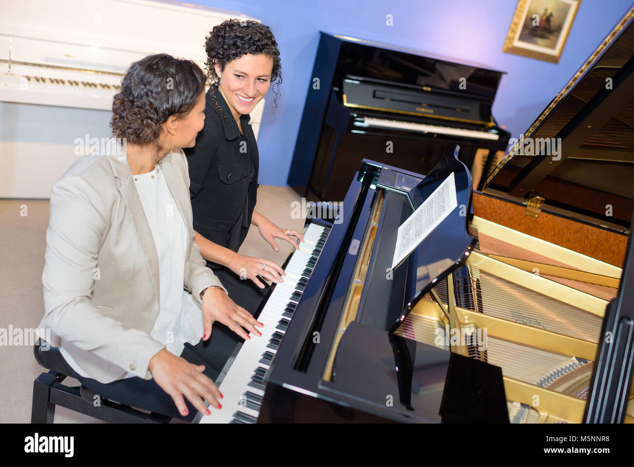 friends playing classical music piano Stock Photo - Alamy