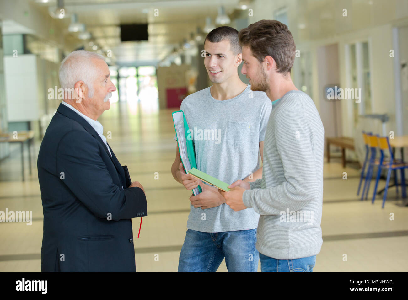 Teacher student talking hallway High Resolution Stock Photography and ...