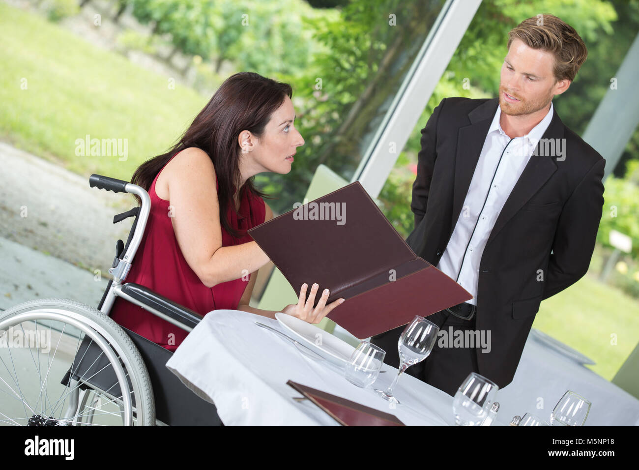 asking the waiter Stock Photo - Alamy