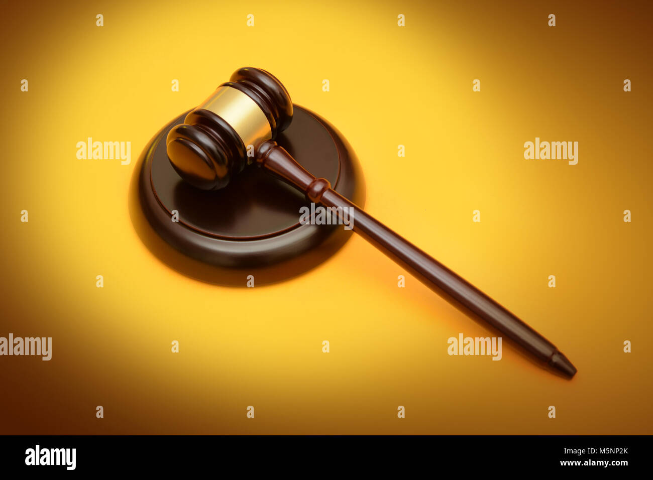 Wooden Judge Gavel on yellow background law concept Stock Photo - Alamy