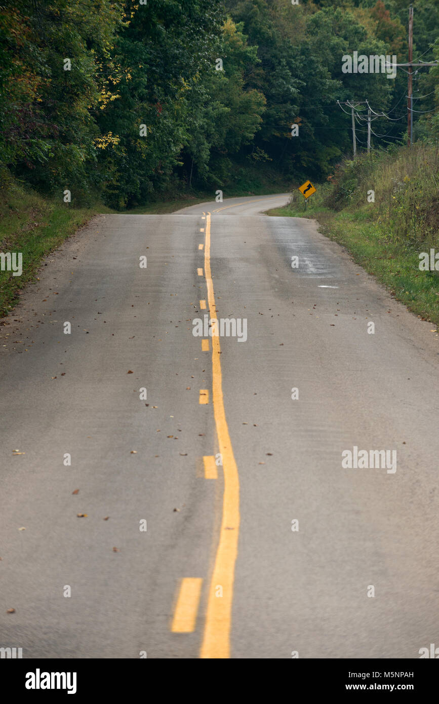 Rural country road on beautiful countryside between the farms Stock ...