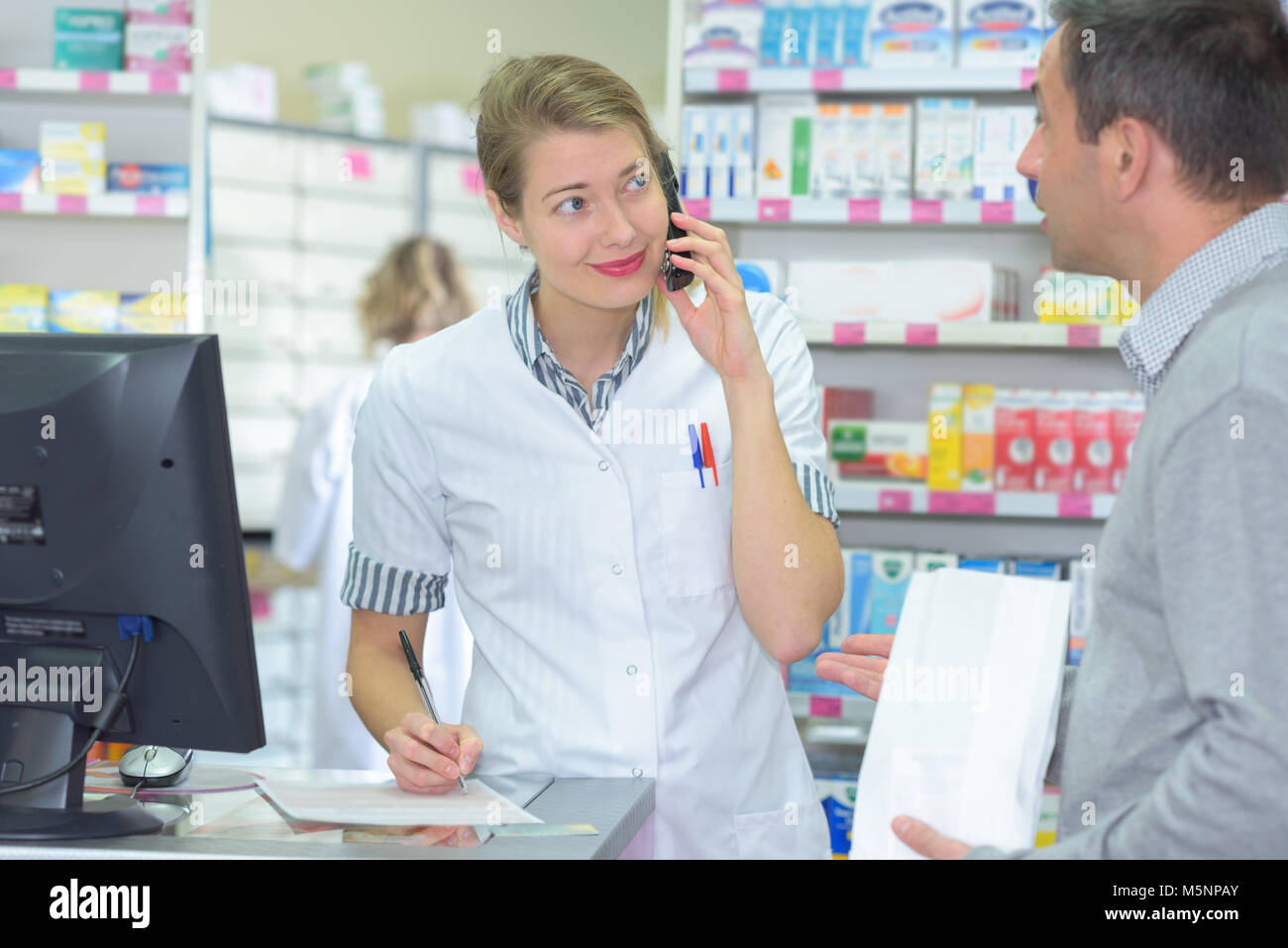 pharmacist on the phone Stock Photo - Alamy