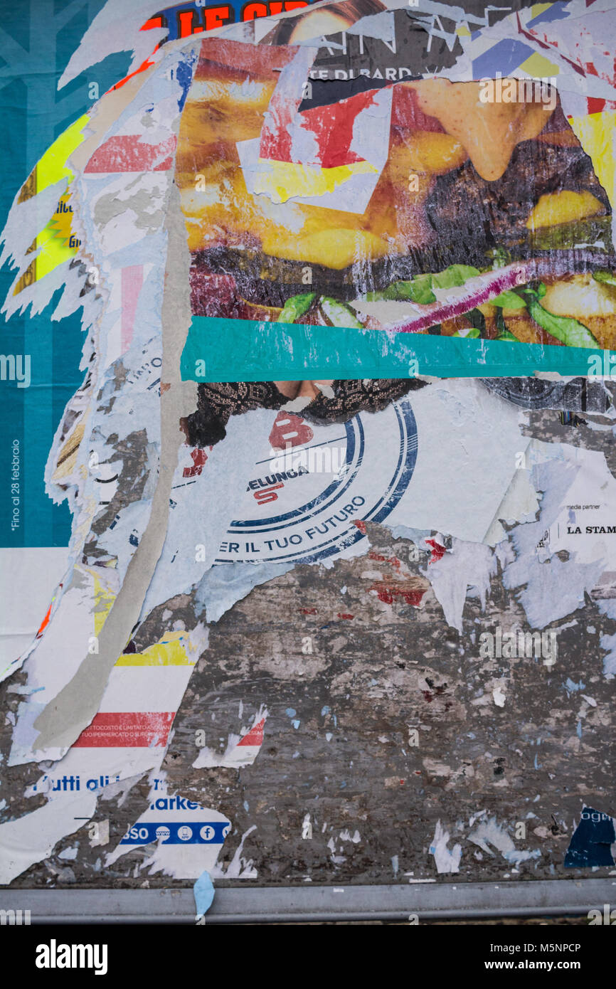 Ruined advertising poster in Italy Stock Photo - Alamy